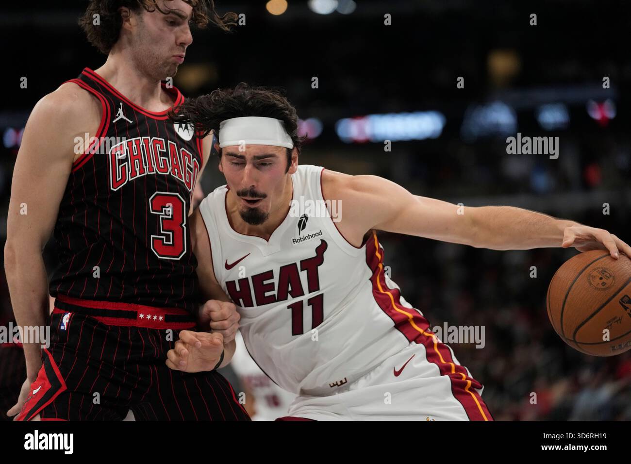 Chicago Bulls guard Josh Giddey (3), left, guards Miami Heat forward ...