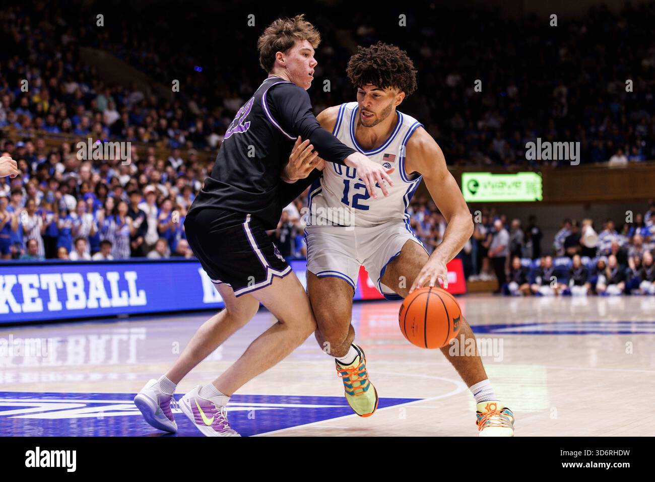 Duke's Cameron Boozer (12) handles the ball as Niagara's Drew Larson ...