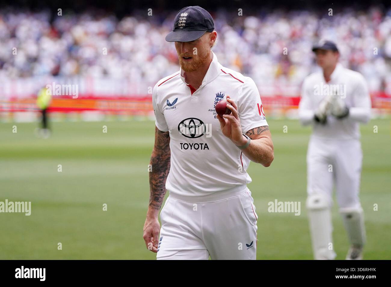 England’s Ben Stokes leads the team off at the end of innings after ...