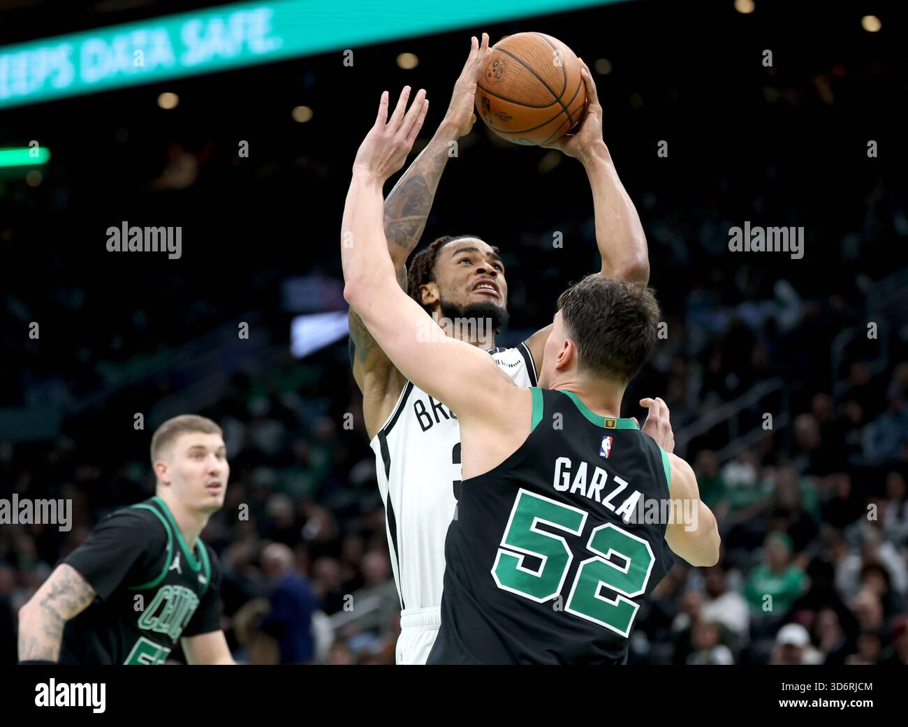 Brooklyn Nets center Nic Claxton, center, shoots over Boston Celtics ...
