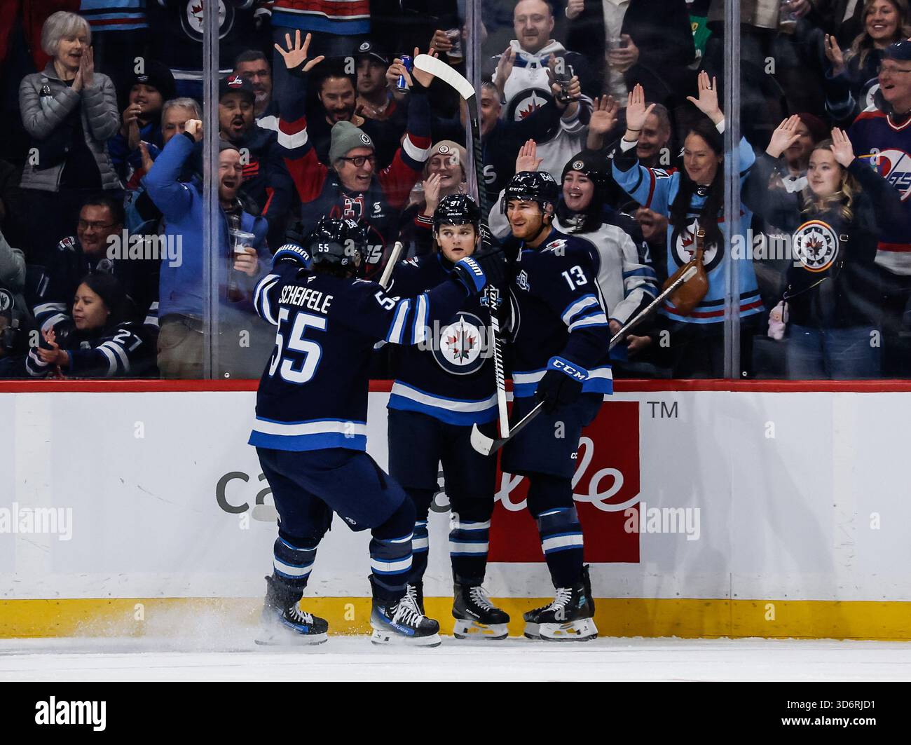 Winnipeg Jets' Mark Scheifele (55), Cole Perfetti (91) and Gabriel ...