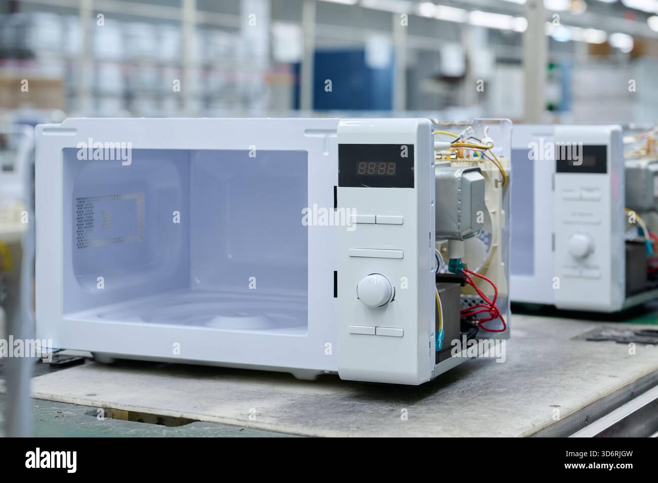 Production of household microwave ovens in an assembly workshop within ...