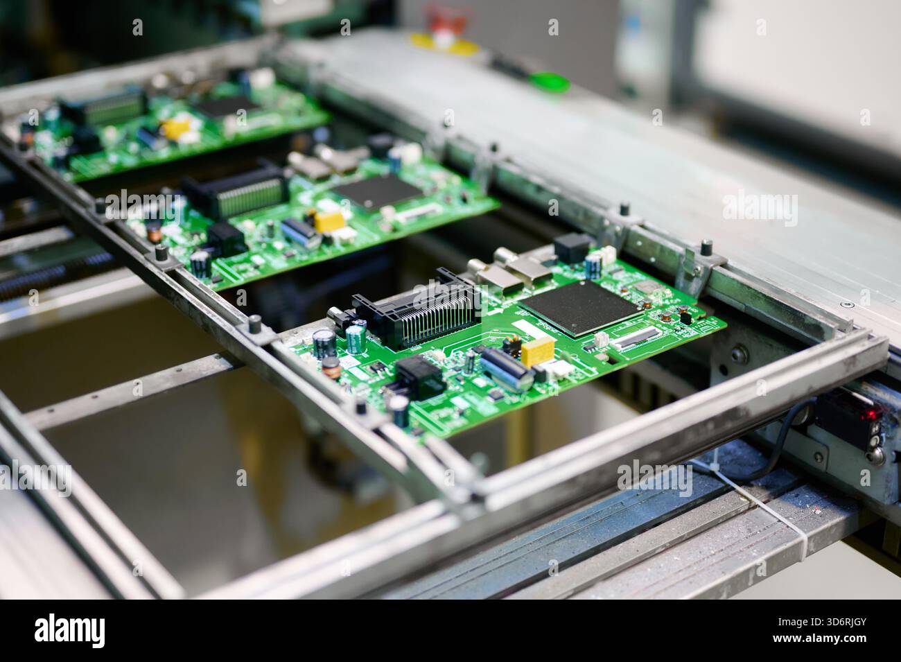 Electronic circuit boards moving along an assembly line at a ...