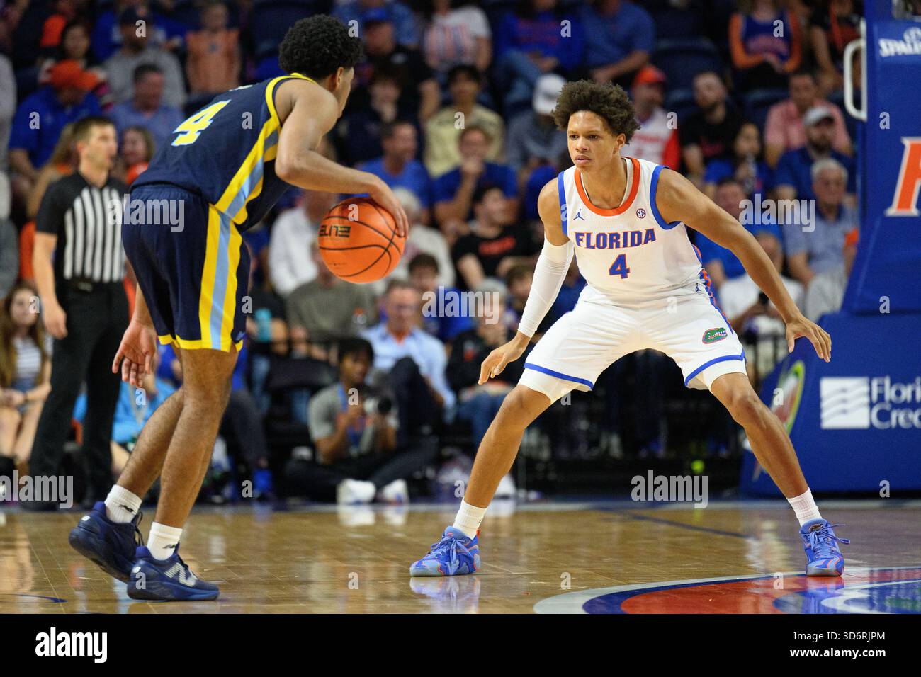 Merrimack guard Tye Dorset (4) dribbles against Florida guard Alex ...