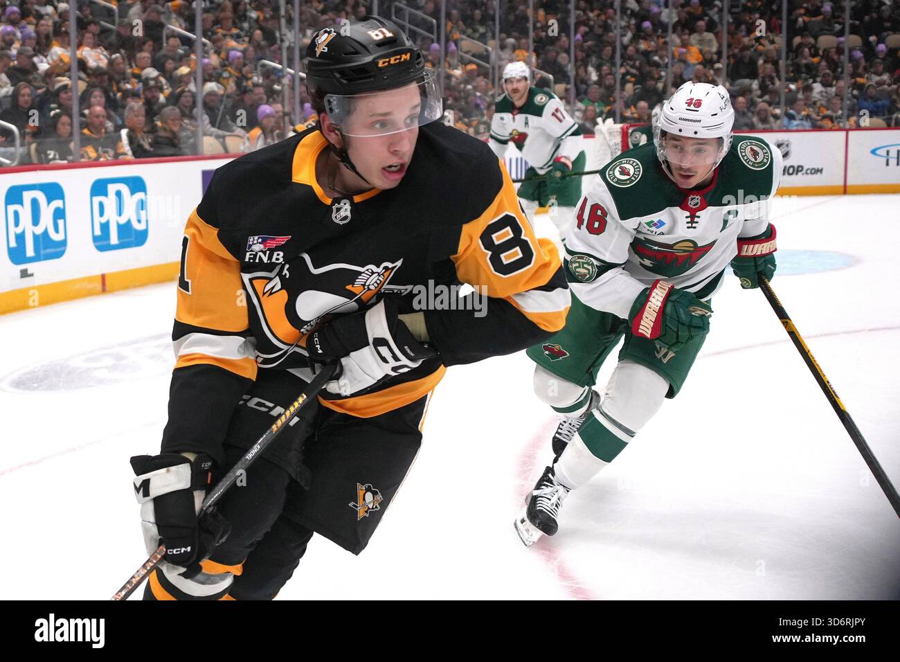 Pittsburgh Penguins' Ben Kindel (81) works the puck in the corner with ...