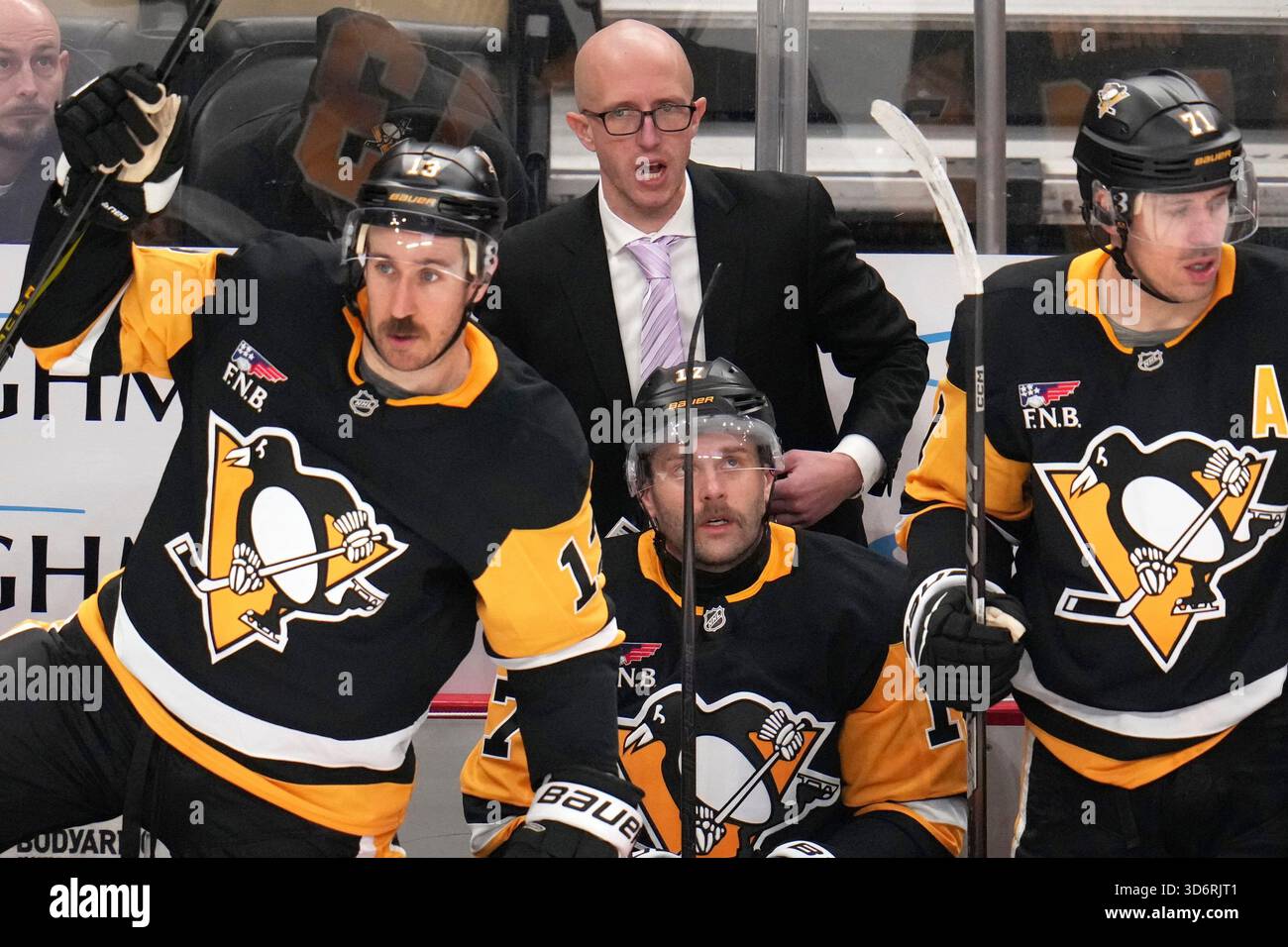 Pittsburgh Penguins head coach Dan Muse, top center, gives instructions ...