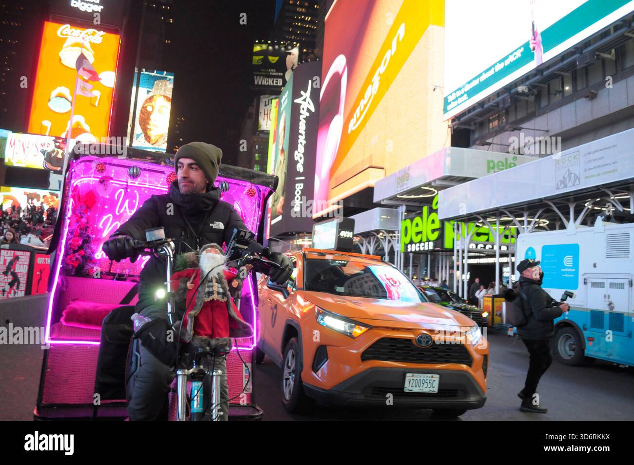 A pedicab driver is seen in Times Square, Manhattan, New York City ...