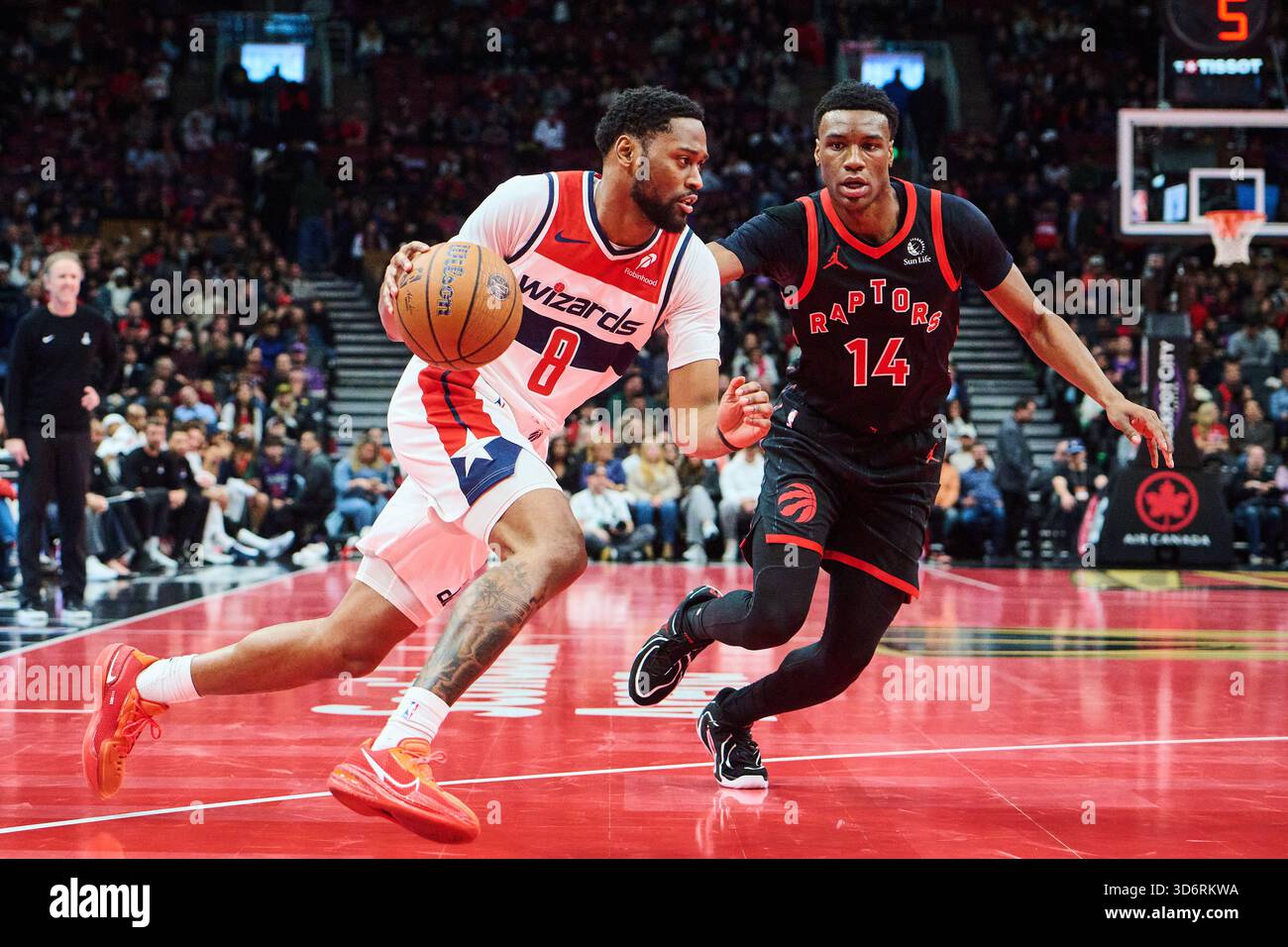 Washington Wizards' Malaki Branham (8) drives past Toronto Raptors' Ja ...
