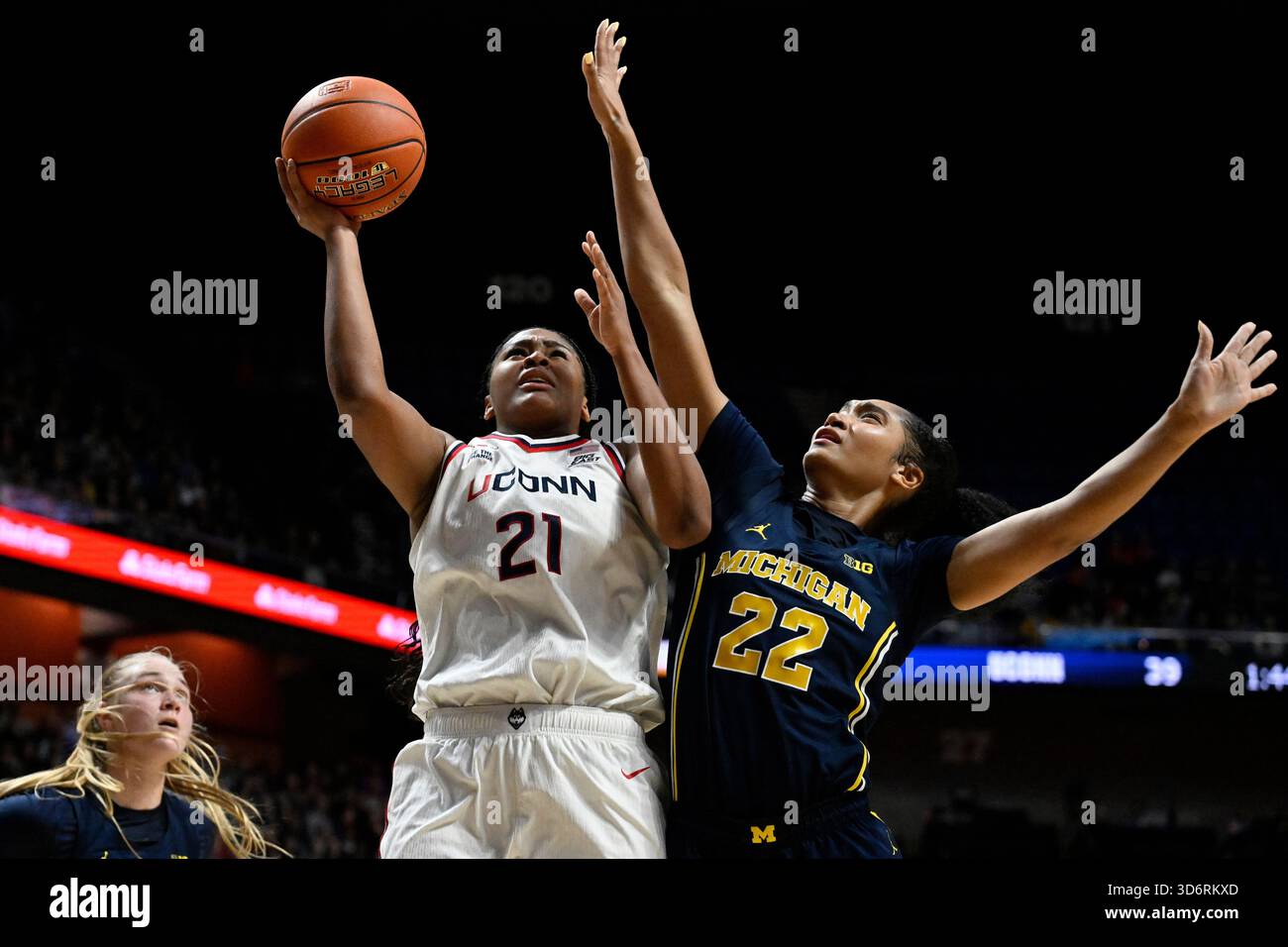UConn forward Sarah Strong (21) shoots as Michigan forward Kendall ...