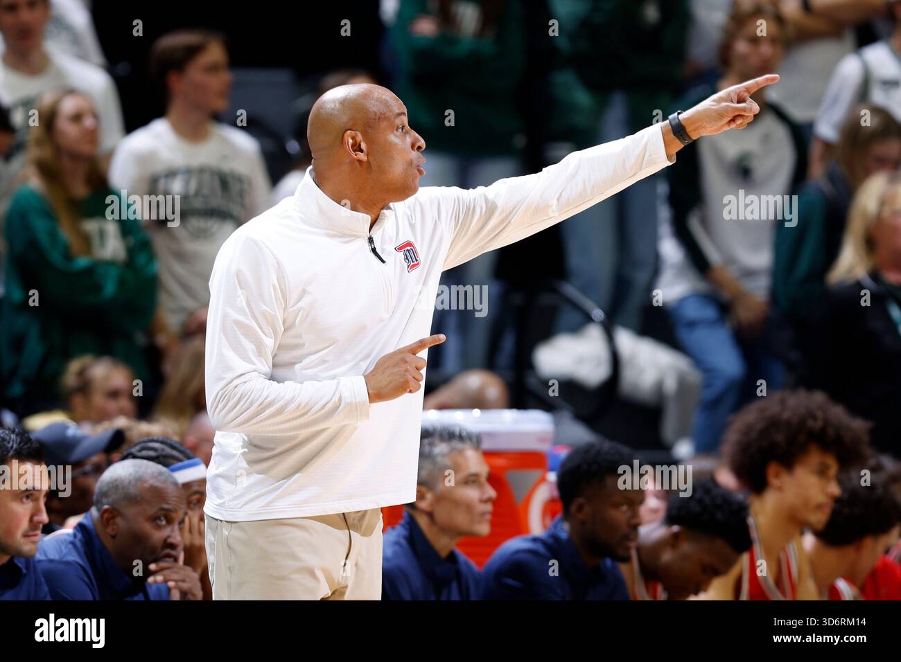 Detroit Mercy coach Mark Montgomery signals during an NCAA college ...