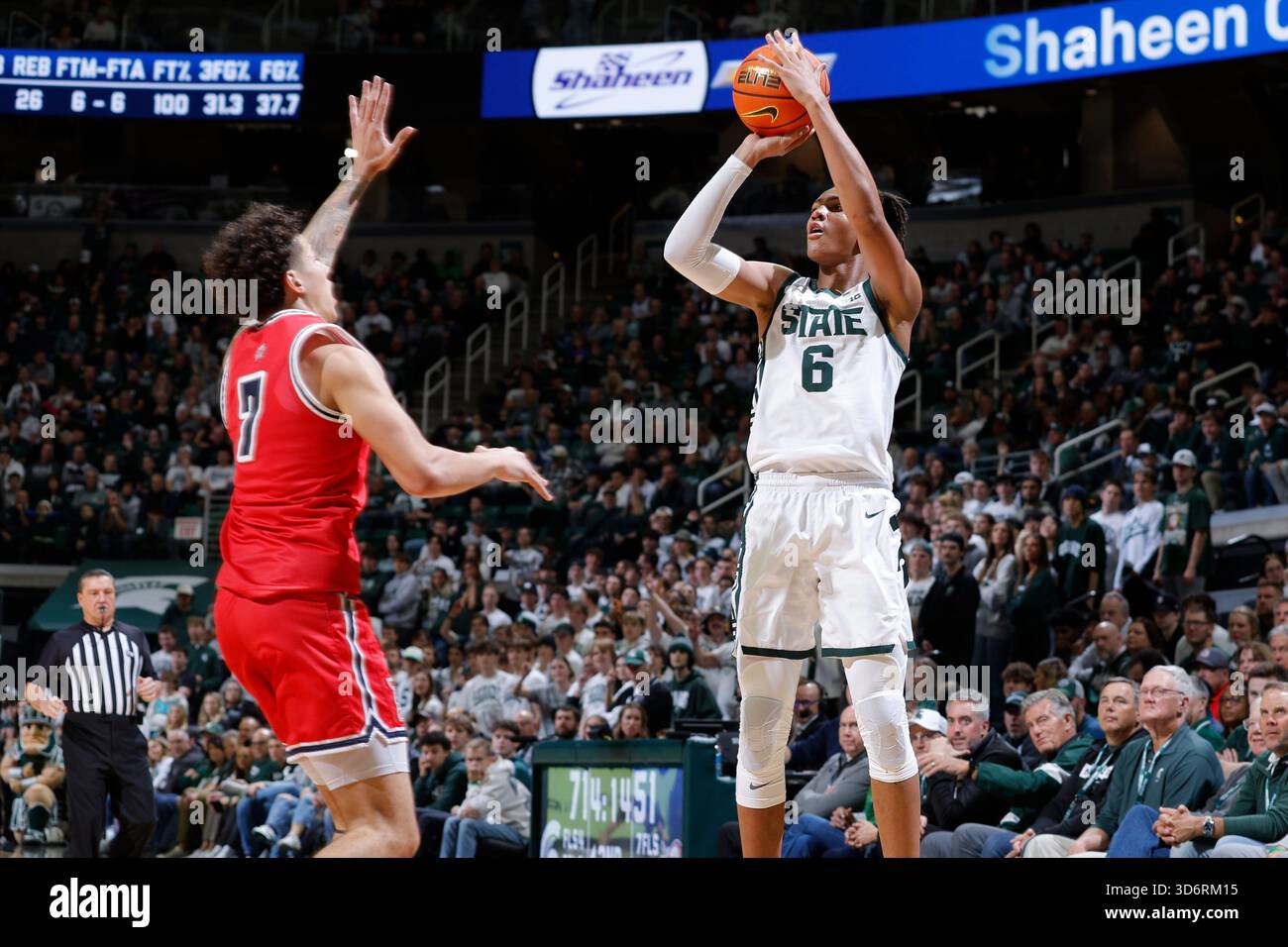 Michigan State forward Jordan Scott (6), right, shoots against Detroit ...