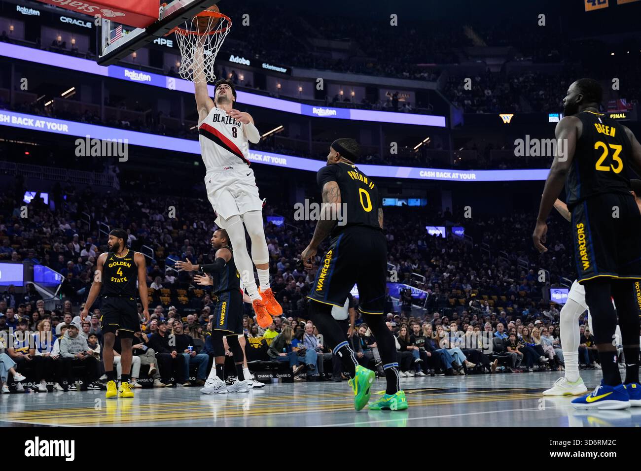Portland Trail Blazers forward Deni Avdija (8) shoots next to Golden ...