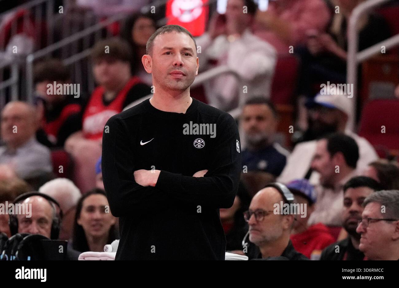 Denver Nuggets head coach David Adelman stands on the sideline during ...