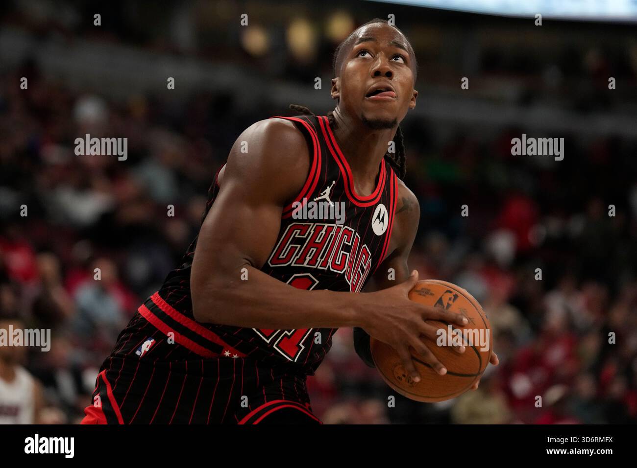 Chicago Bulls guard Ayo Dosunmu handles the ball during the second half ...