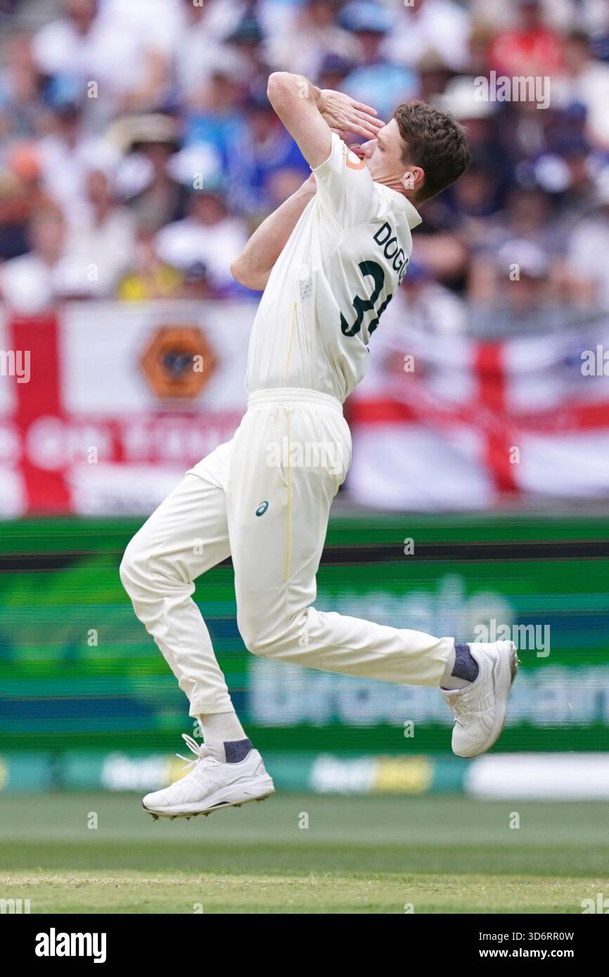 Australia's Brendan Doggett bowls on day two of the first test of the ...