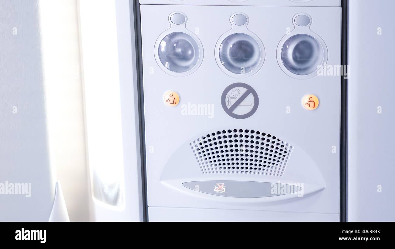 Airplane cabin control panel displays buttons and indicators for ...