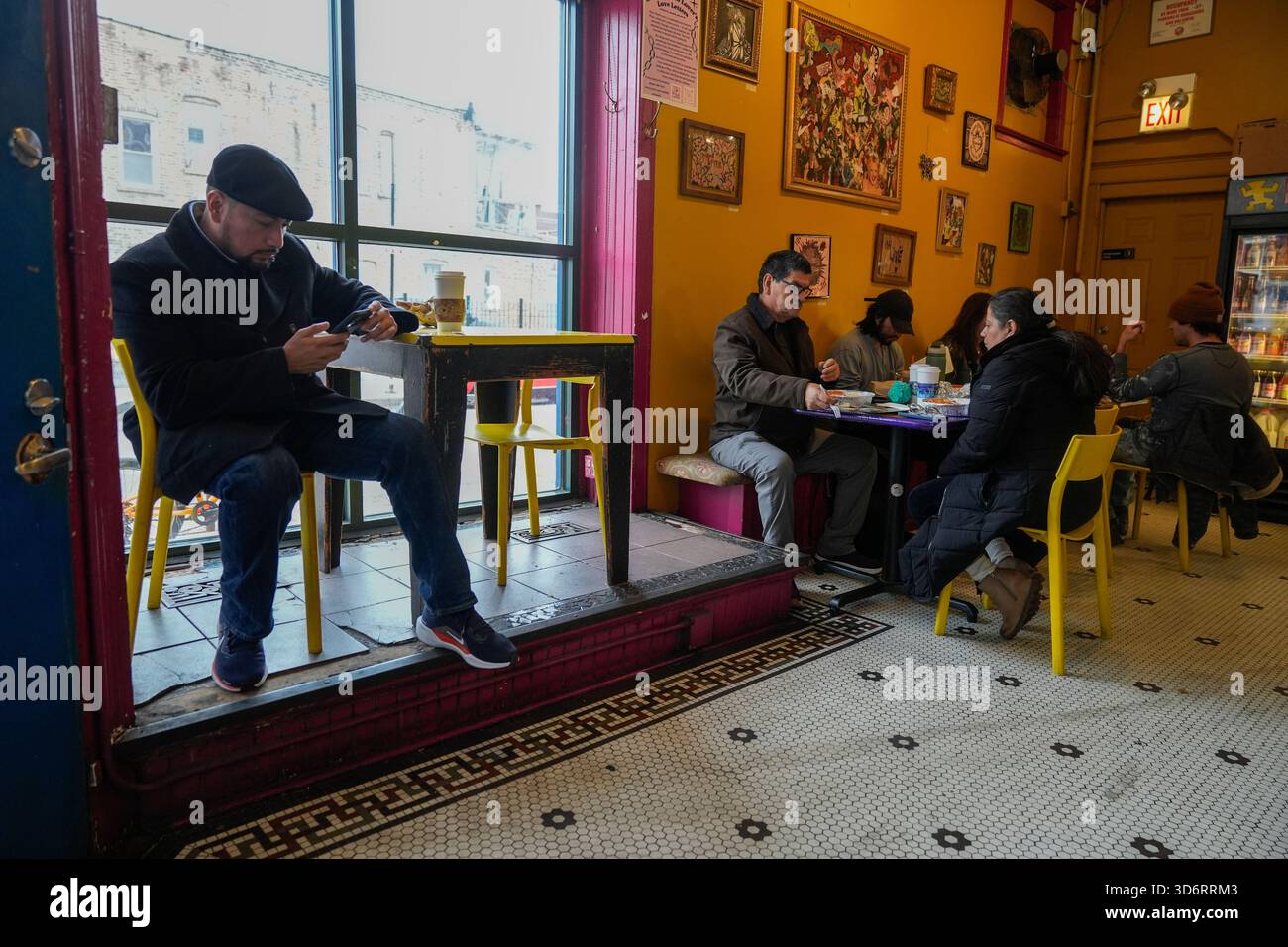 People hang out at Cafe Jumping Bean, Wednesday, Nov. 19, 2025, in the ...