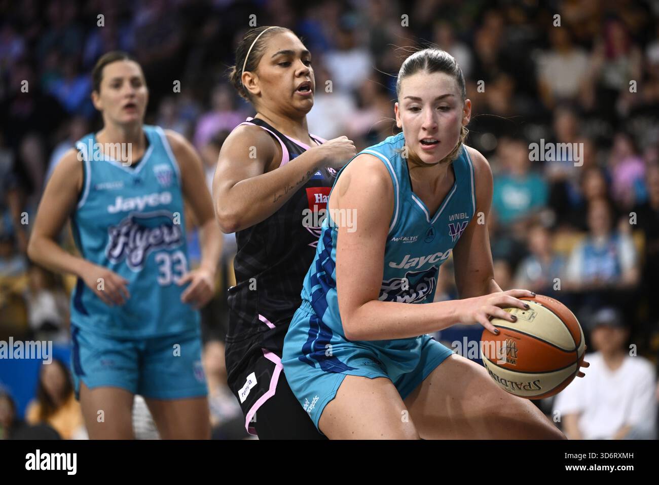 Isabelle Bourne of the Flyers (right) during the WNBL Round 6 match ...