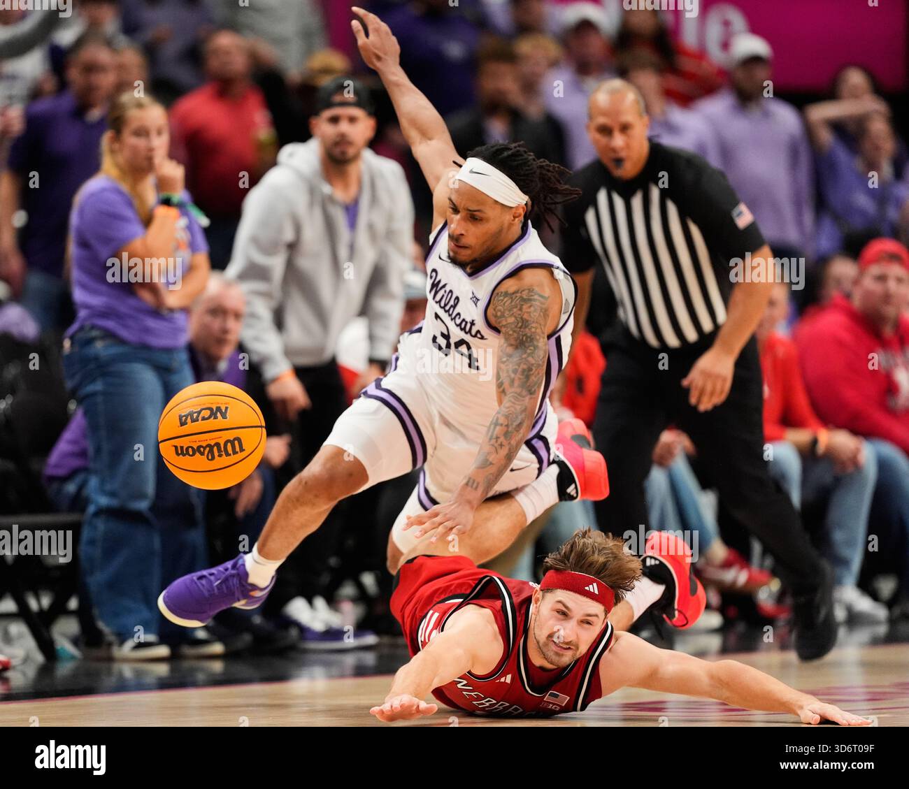 Kansas State guard Nate Johnson (34) and Nebraska guard Sam Hoiberg (1 ...