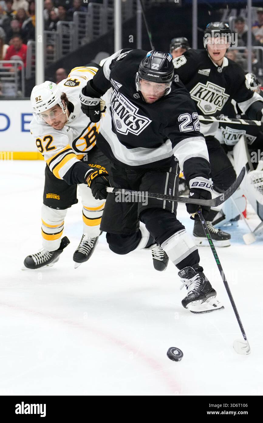 Boston Bruins center Marat Khusnutdinov, left, reaches in on Los ...