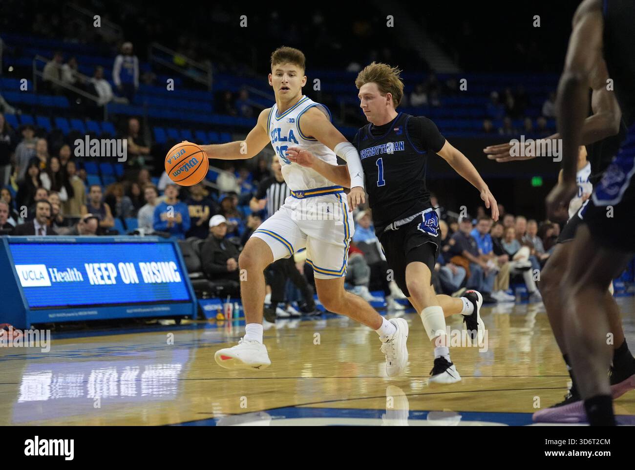 UCLA guard Jack Seidler (30) and Presbyterian guard Luke Allison (1 ...
