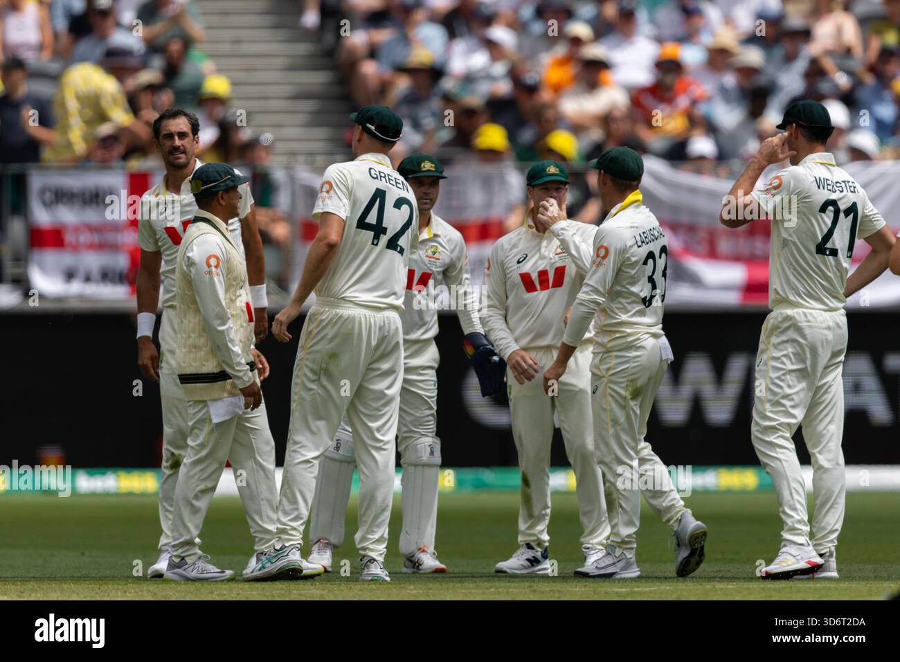 Mitch Starc of Australia is congratulated by his team mates after ...