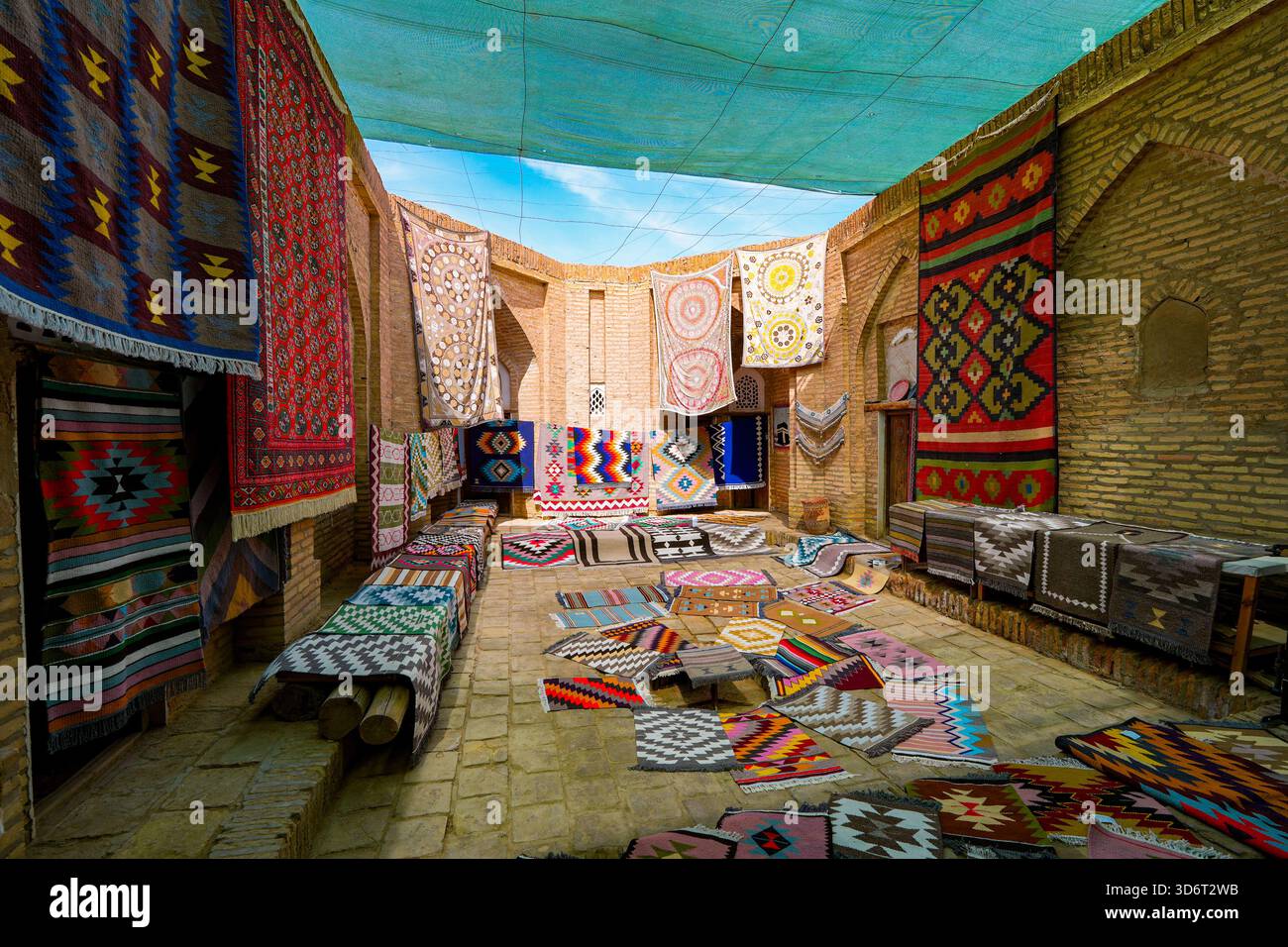 Carpet workshop in the courtyard of the Mazar-i-Sharif Madrasah, Khiva ...