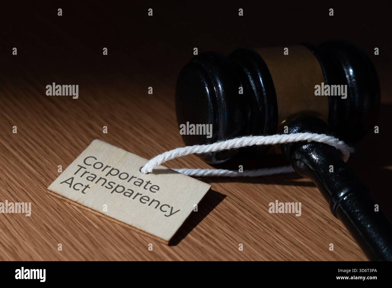 A wooden gavel next to a tag labeled Corporate Transparency Act. Legal ...