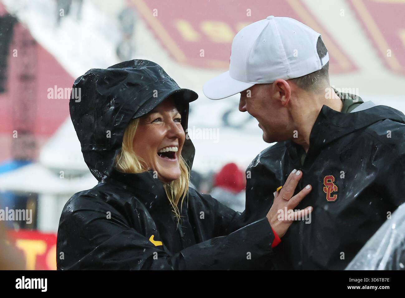 USC athletic director Jennifer Cohen congratulates head coach Lincoln ...