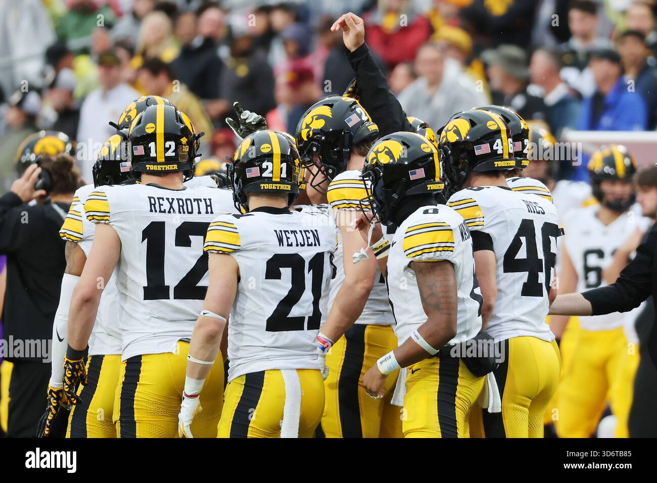 Iowa players huddle during an NCAA college football game against USC ...