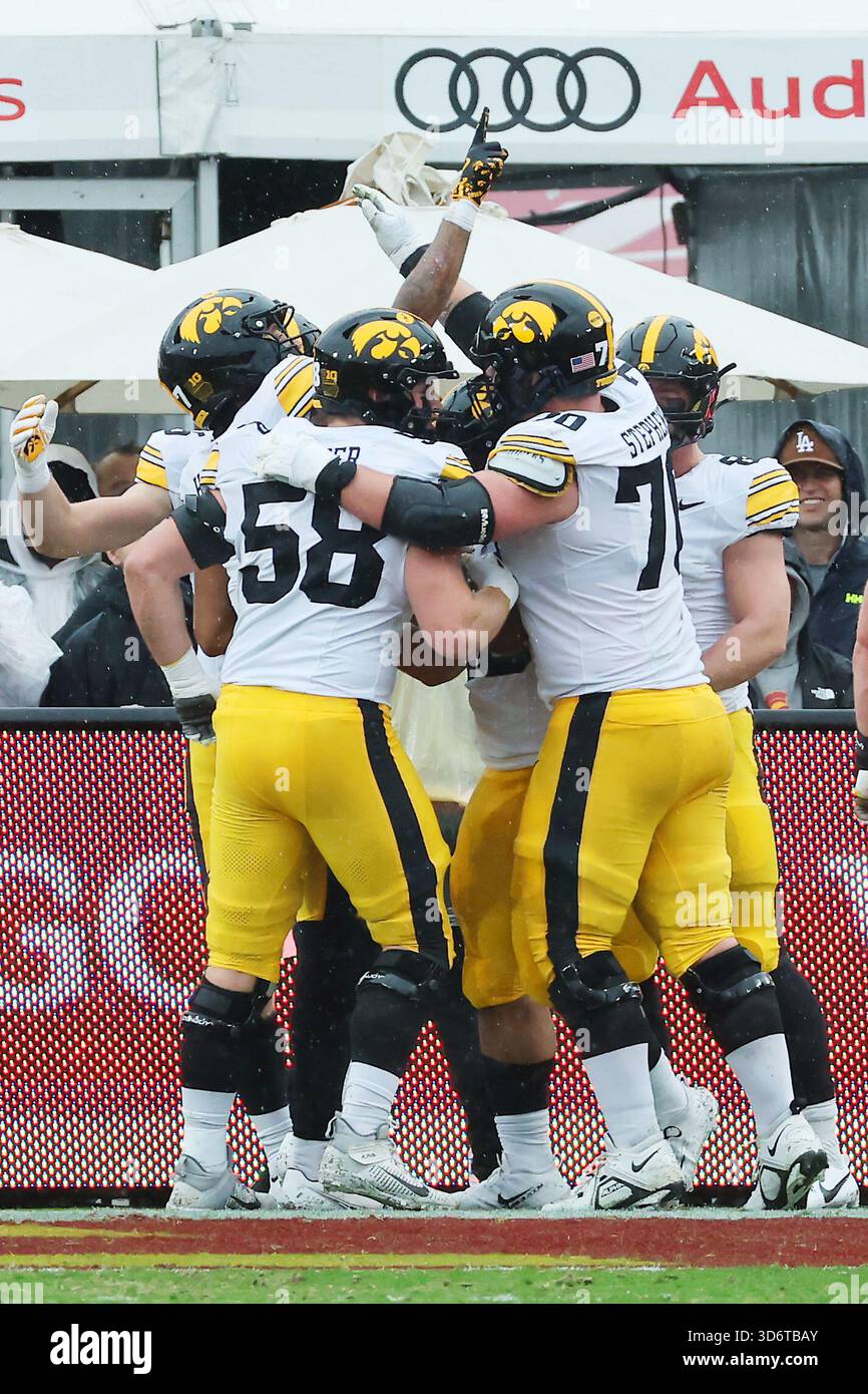 Iowa players celebrate in the end zone during an NCAA college football ...