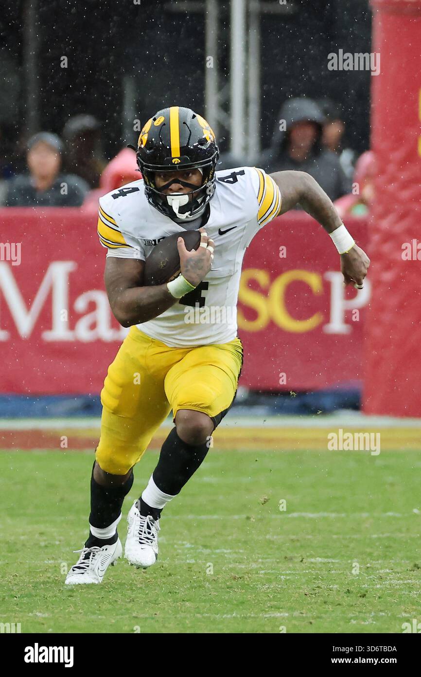 Iowa running back Jazuin Patterson (4) runs the ball during an NCAA ...