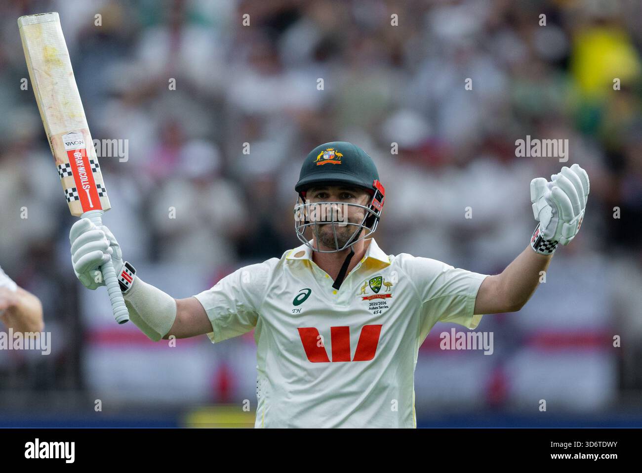 Travis Head of Australia raises bat after scoring a century during the ...