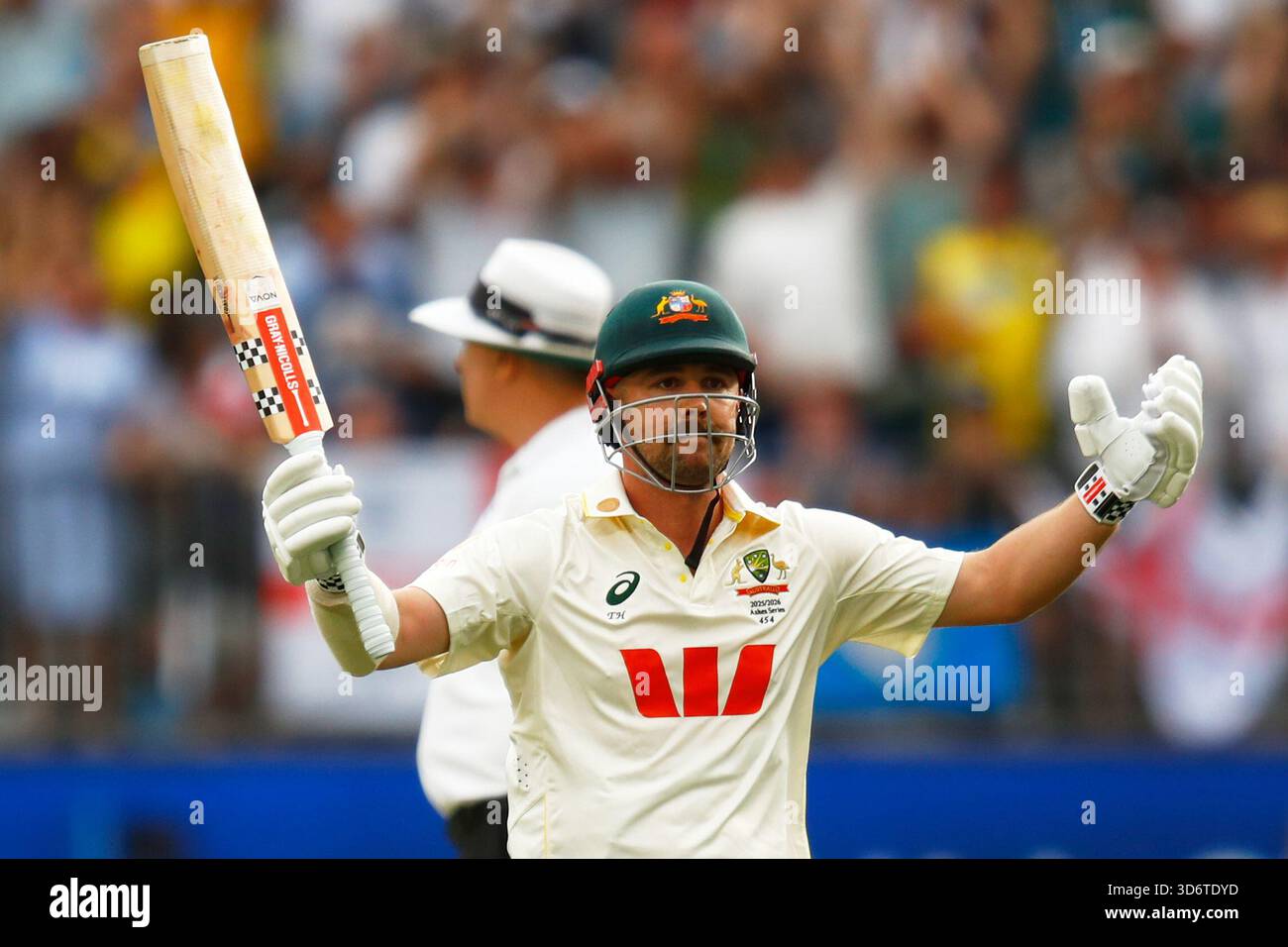 Australia's Travis Head celebrates his century on day two of the first ...
