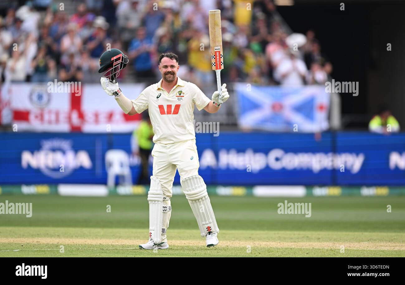 Australian batsman Travis Head reacts after scoring a century on Day 2 ...