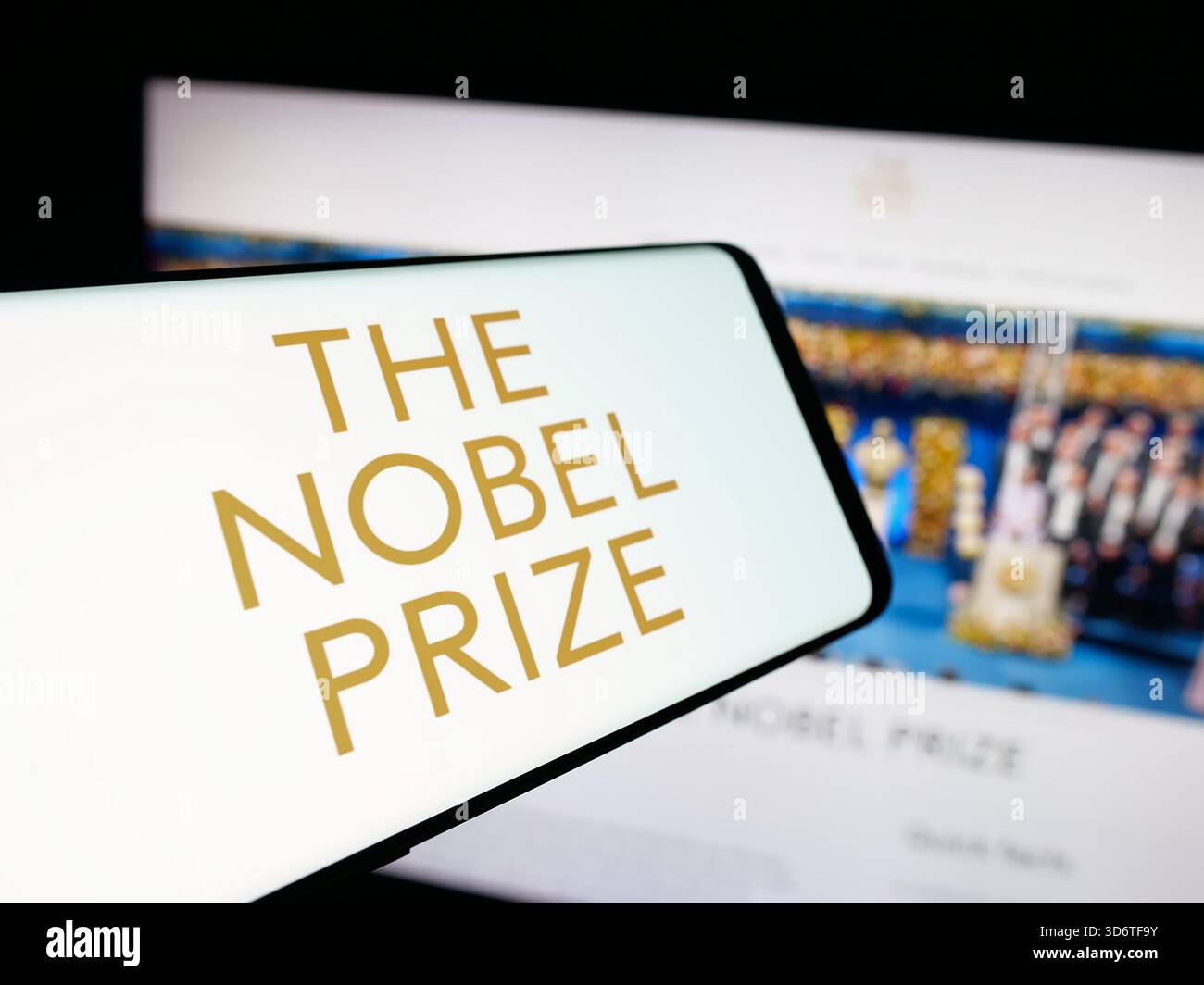 In this photo illustration, a smartphone with the logo of awards Nobel ...