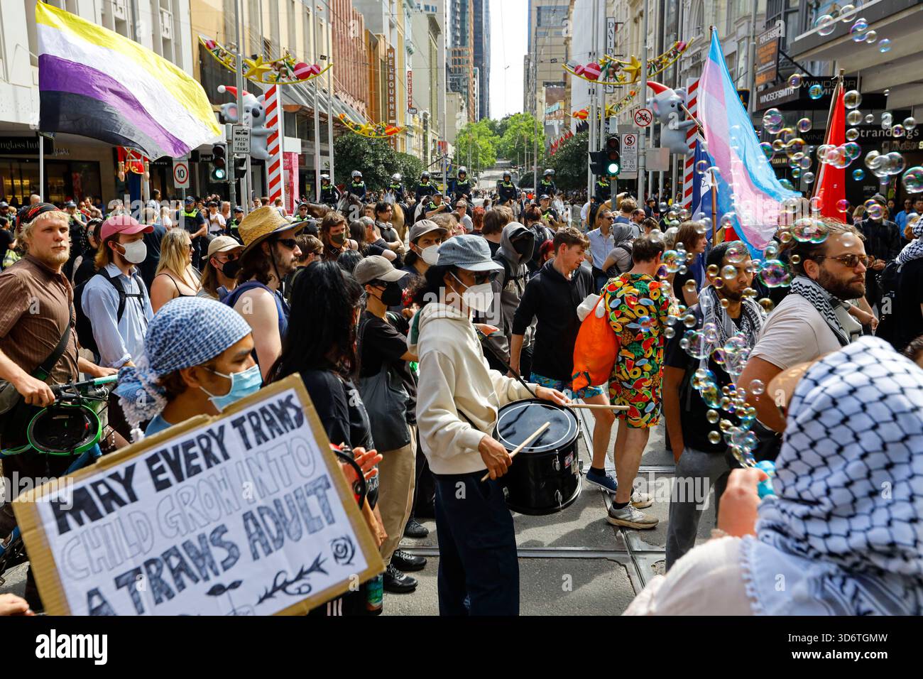A protester holds a placard during the rally. Activists gather at ...