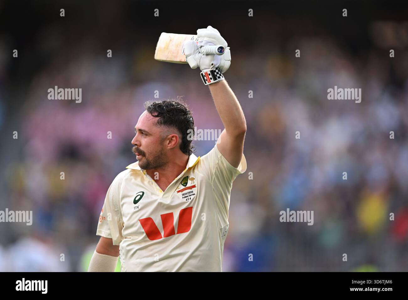 Australian batsman Travis Head reacts to the crowd applause as he ...