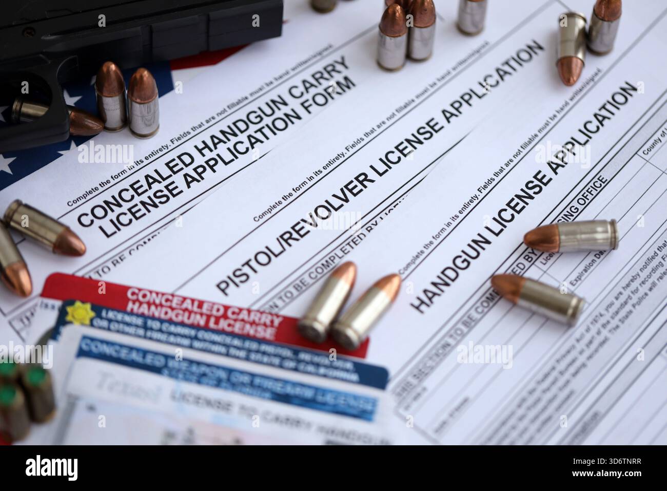USA firearms license and handgun with bullets on US Constitution. Gun ...