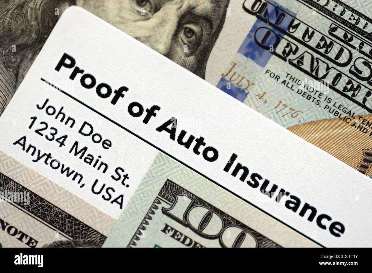Proof of auto insurance card and many hundred dollar bills. Concept of ...