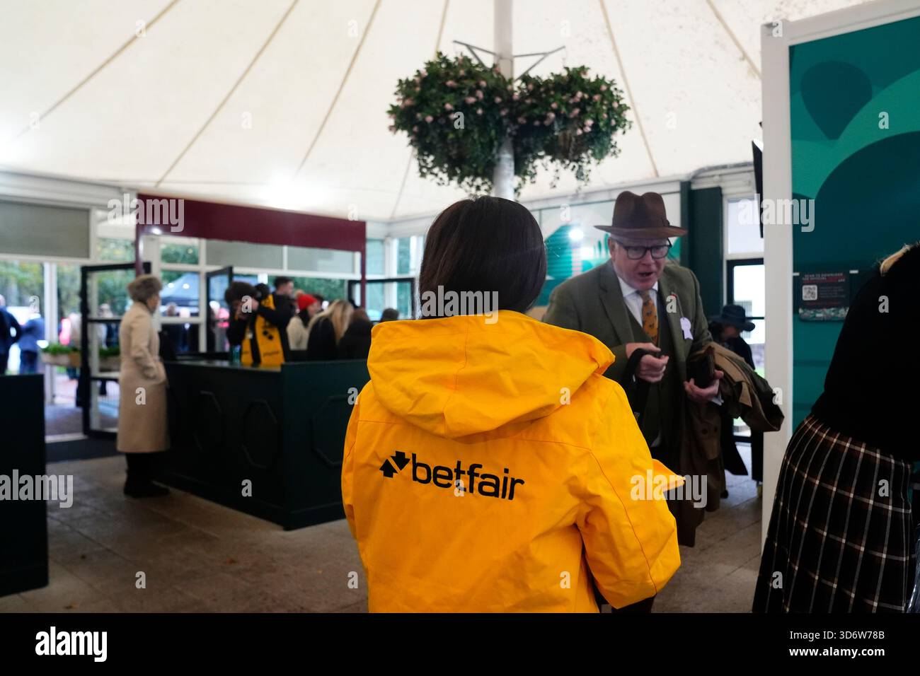 Racegoers are handed Betfair scarves upon arrival during Betfair Chase ...