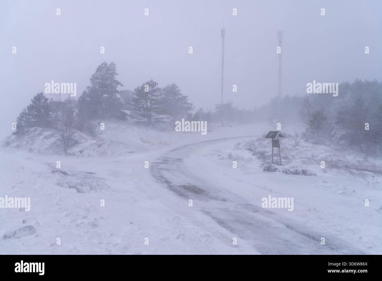 Bora wind and snow on the road between Vratnik and Senj. The road is ...
