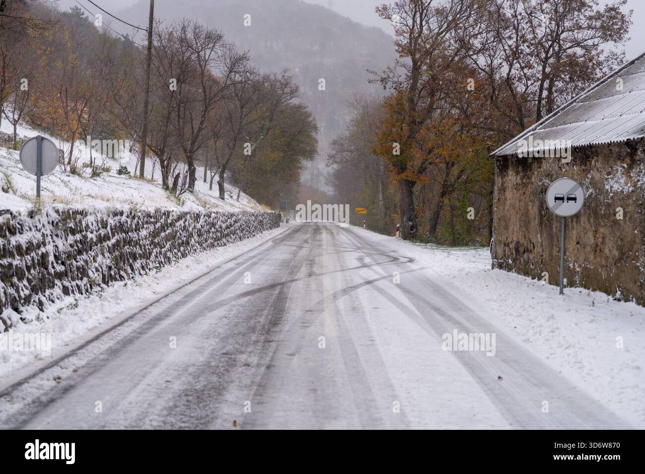Bora wind and snow on the road between Vratnik and Senj. The road is ...