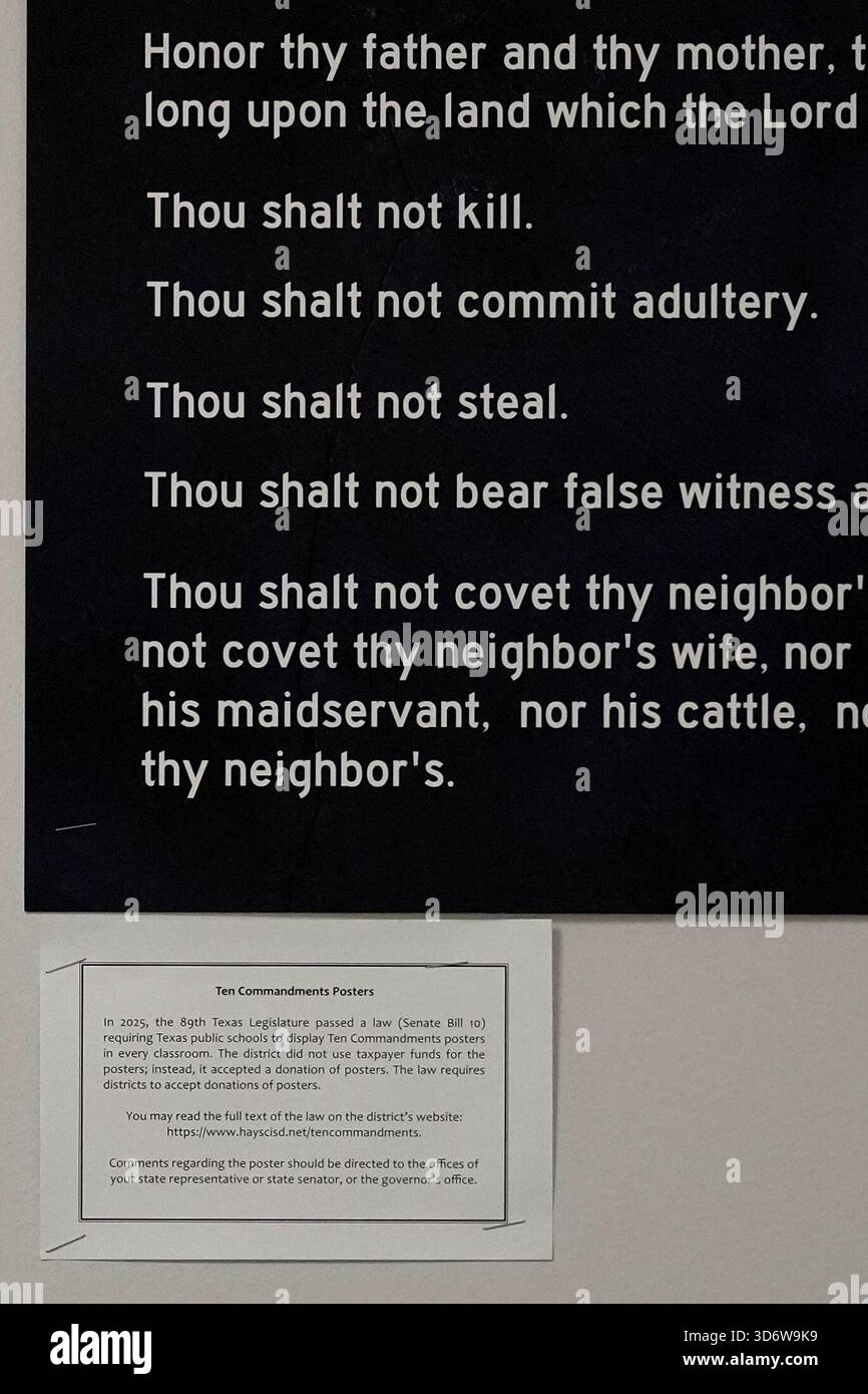 A Ten Commandments poster and explanation of the state's new law are ...