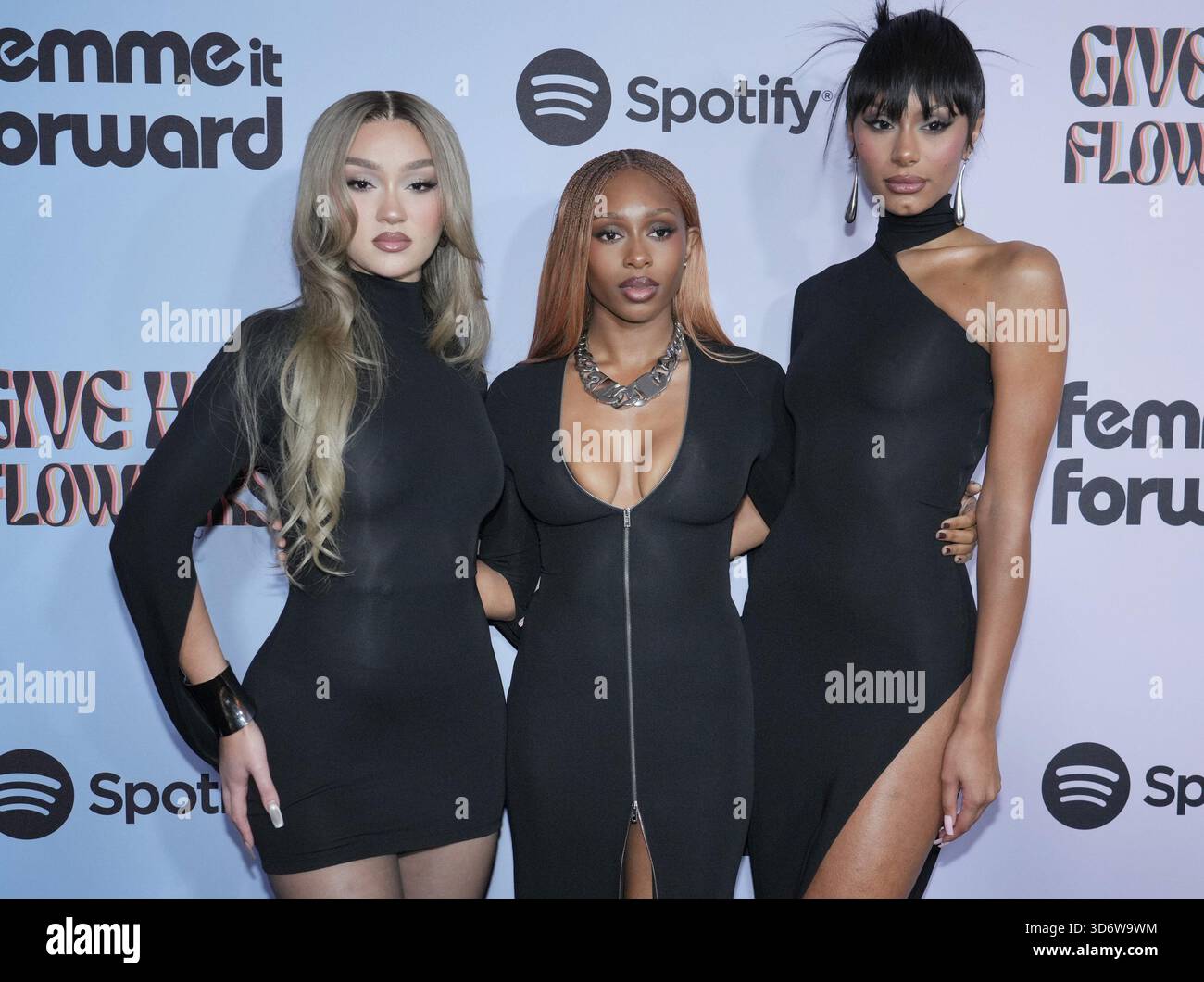 (L-R) FLO - Stella Quaresma, Renee Downer and Jorja Douglas at the Give ...