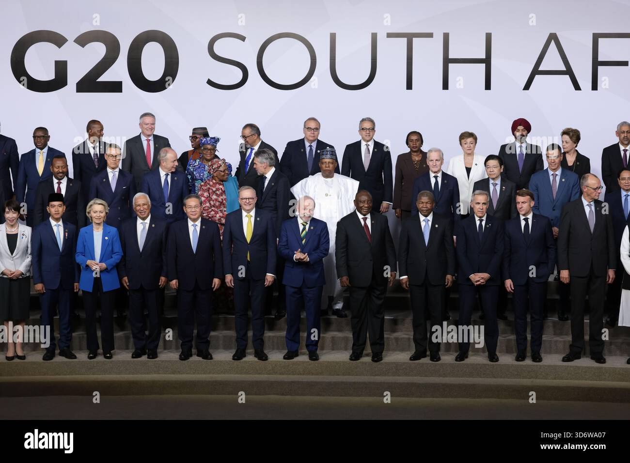 Leaders and delegates pose for a group photo, on the opening day of the ...