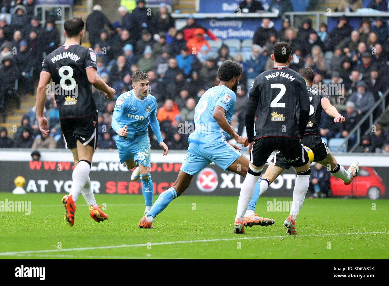 Coventry City's Josh Eccles scores his team's first goal with a header ...