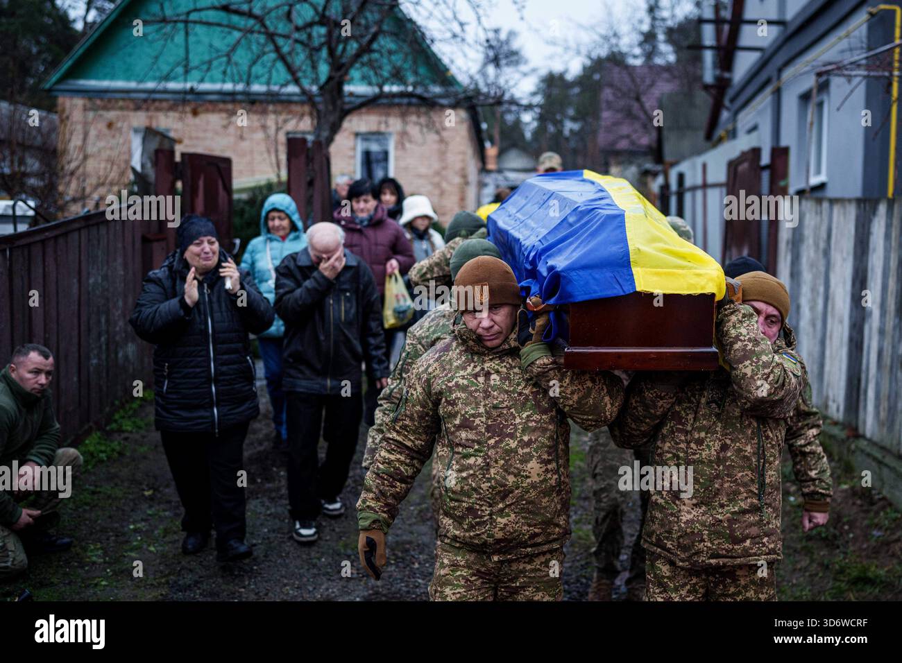 An honor guard carries the coffin of Ruslan Zhygunov, a Ukrainian ...