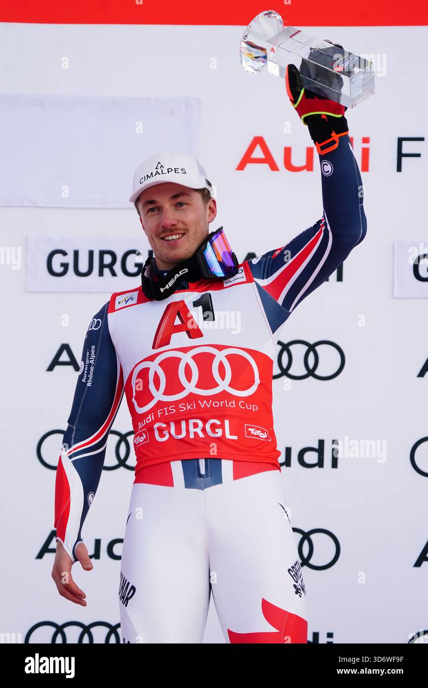France's Paco Rassat celebrates on the podium after winning an alpine ...