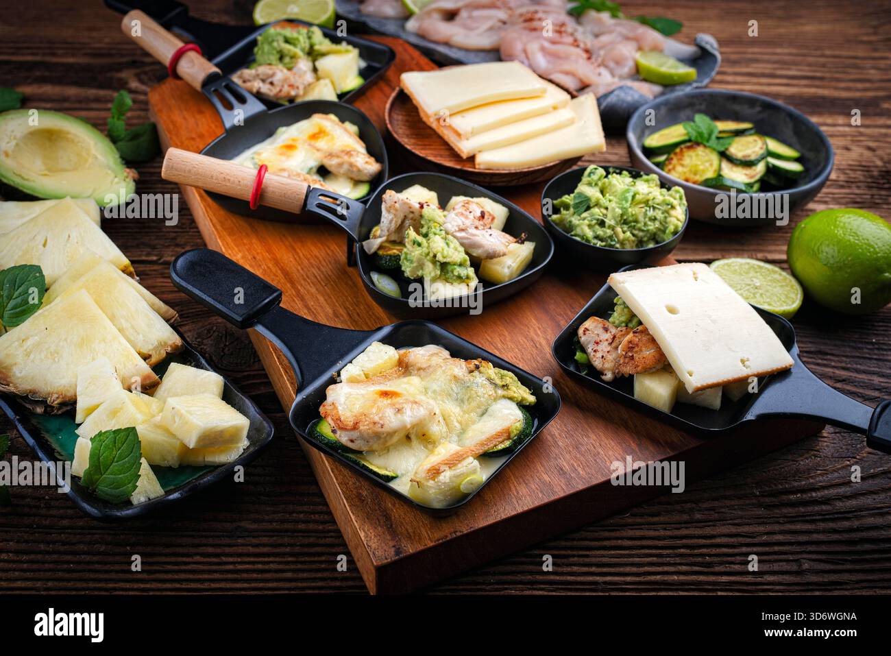 traditional authentic swiss raclette with chicken filet meat, pineapple ...